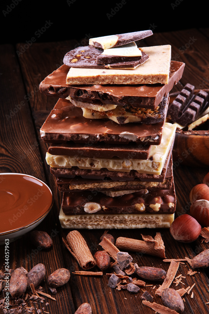 Chocolate bars on table with chocolate tower. Stock Photo | Adobe Stock