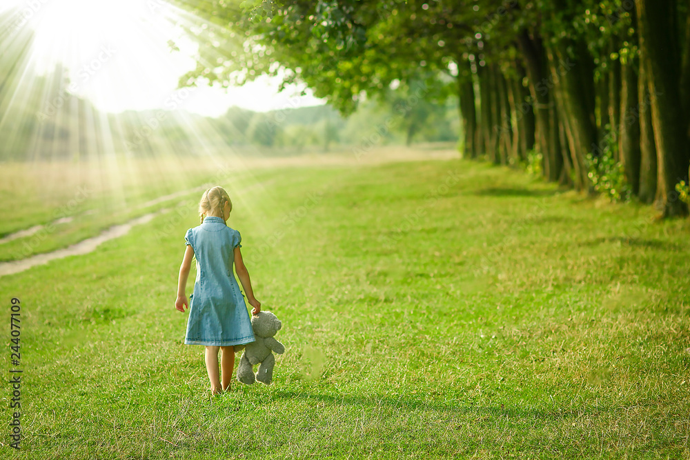 Little girl with a little bear Stock Photo | Adobe Stock