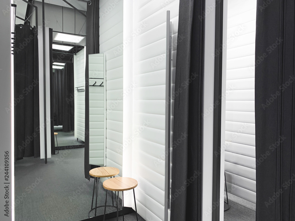 Fitting room in a clothing store. Shopping concept. Interior of the ...