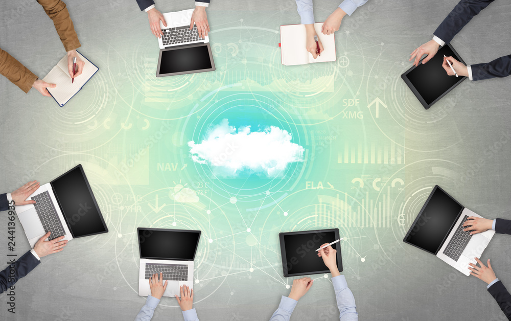 Group of people with devices in hands working on reports with online ...