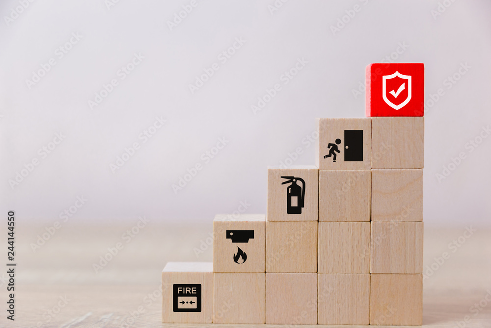 Place the wooden blocks into steps. 100 percent work safety concept ...