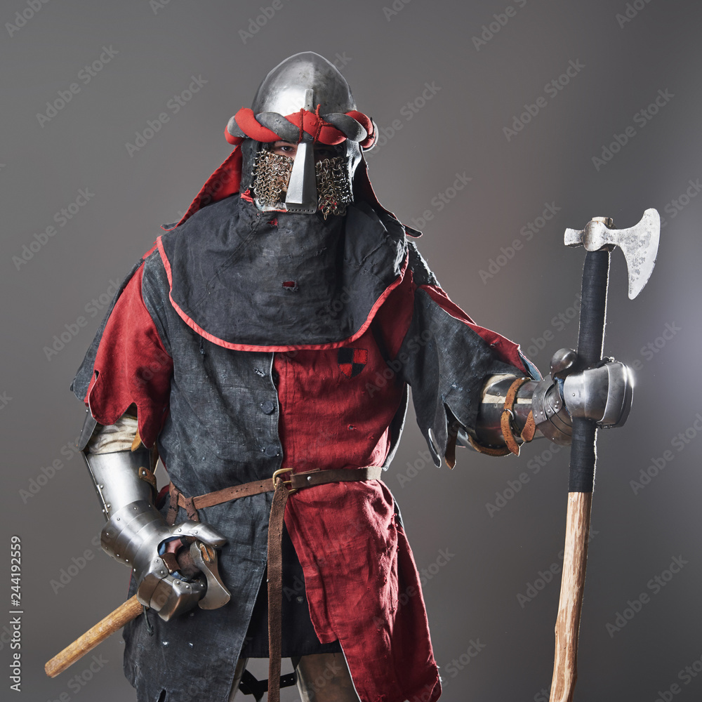 Medieval knight on grey background. Portrait of brutal dirty face ...