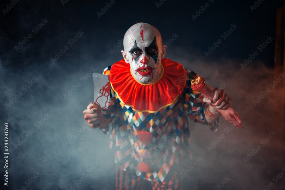 Bloody clown with meat cleaver and baseball bat Stock Photo | Adobe Stock