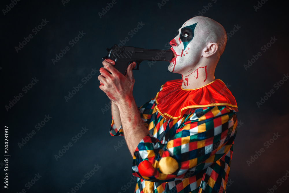 Mad bloody clown with a gun in his mouth Stock Photo | Adobe Stock