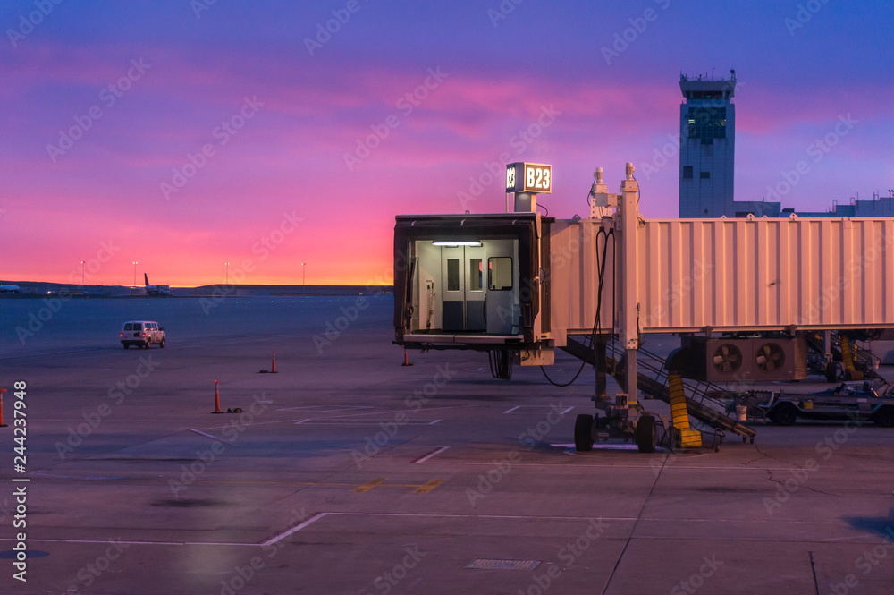 Jetway Doors on and Airport Runway at Sunrise with Flight Control Tower ...