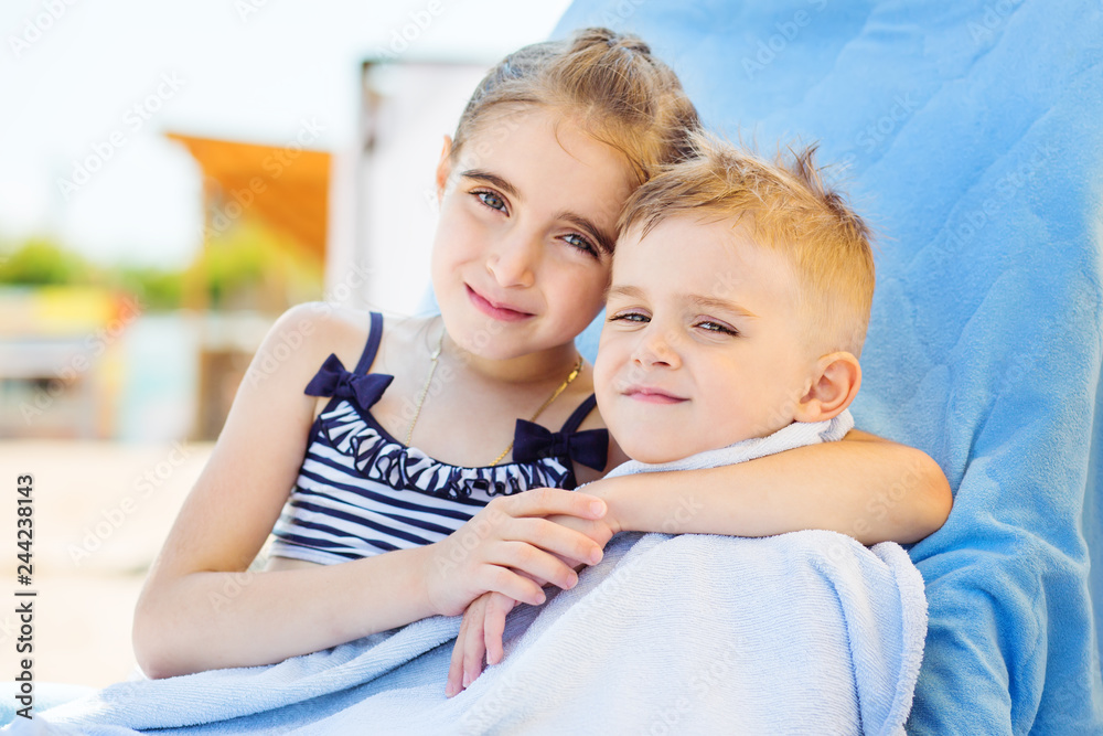 Older Brother And Sister Hugging