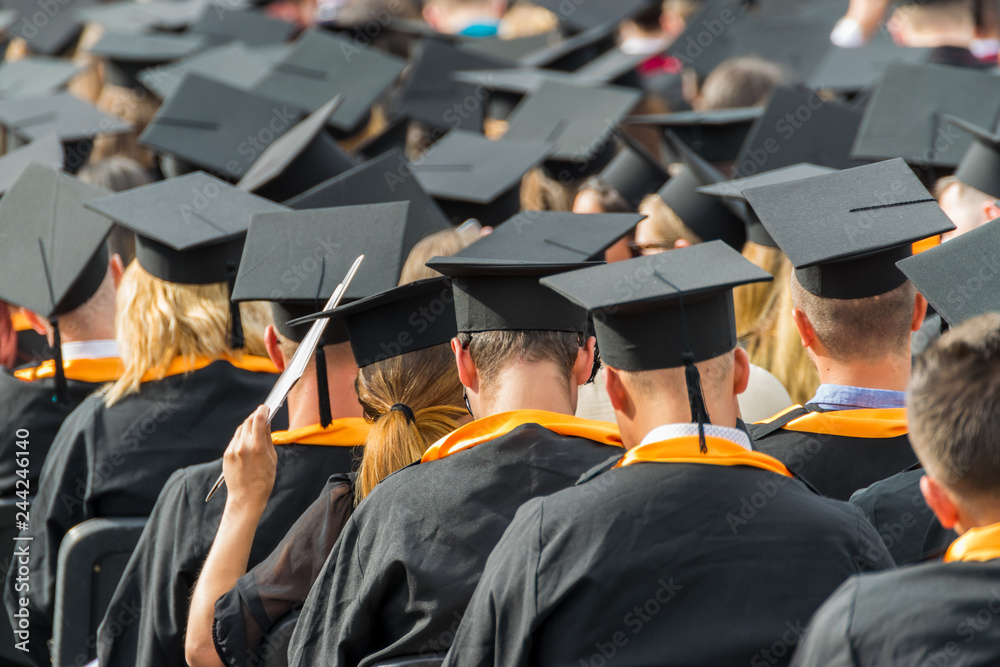 Yong student wearing graduation caps at a graduation ceremony Stock ...