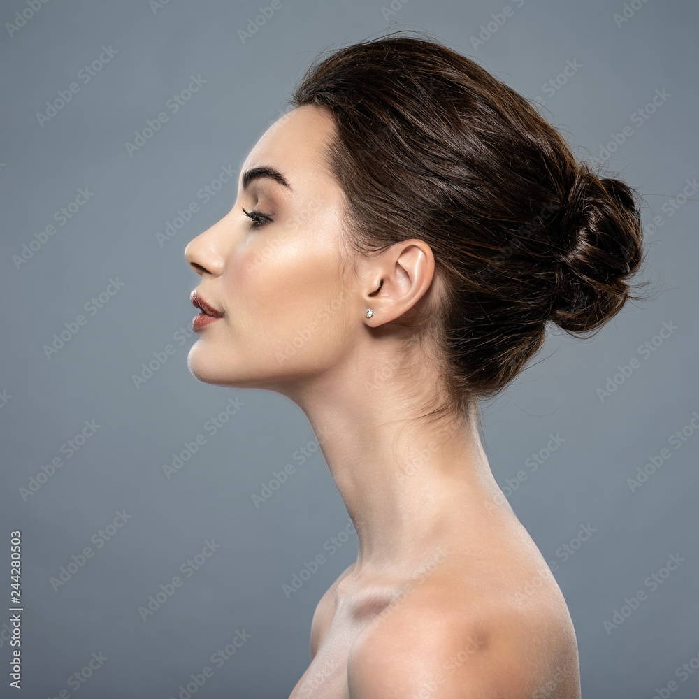 Beautiful woman cares for the skin neck Stock Photo | Adobe Stock