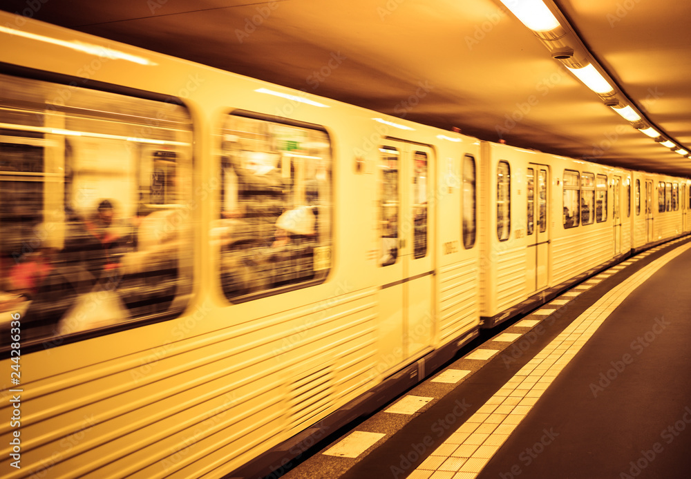 subway train going to the station Stock Photo | Adobe Stock