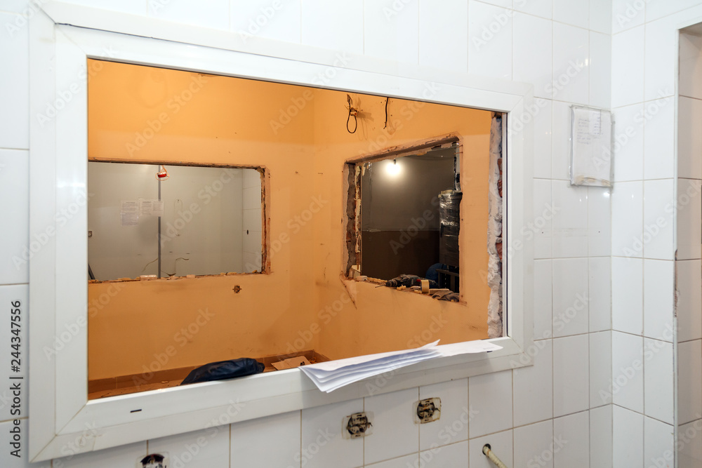 Repair and replacement windows in office building, destroyed window ...