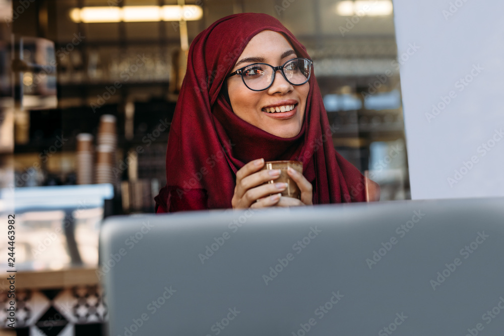 Pretty islamic girl in hijab at coffee shop Stock Photo | Adobe Stock