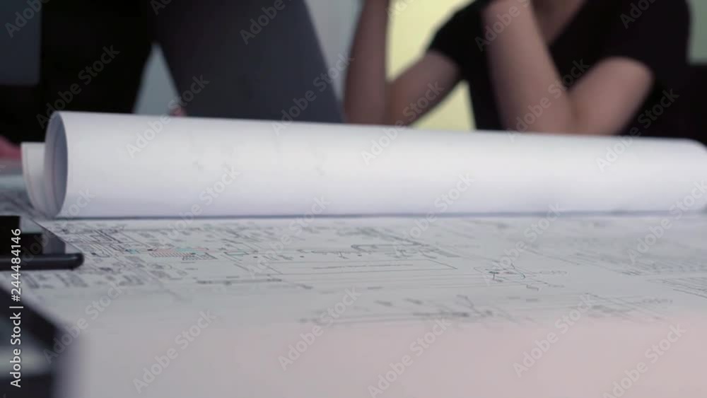 Close-up of professional construction drawings. Stock. Roll of paper ...