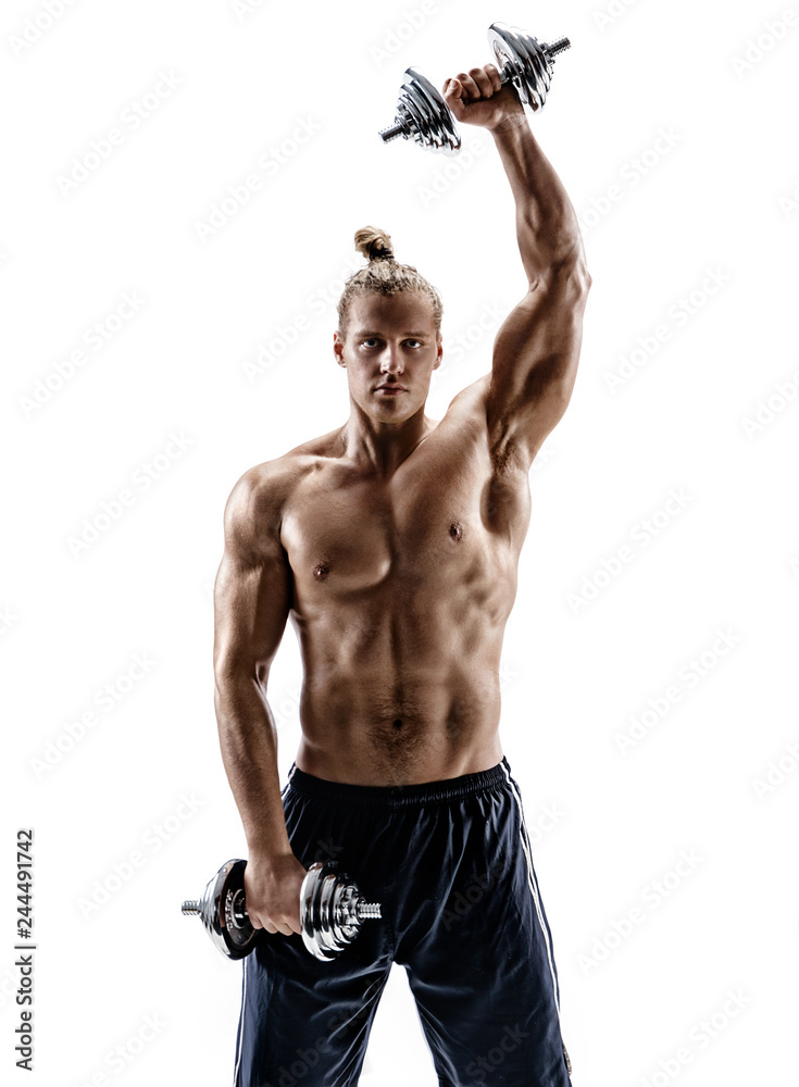 Strong man pumping up muscles with dumbbells. Photo of sporty muscular ...