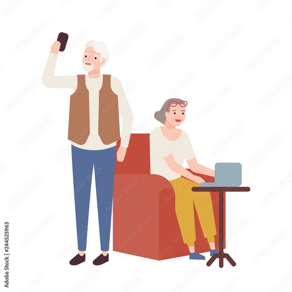 Elderly couple using modern devices. Grandmother working on laptop and ...