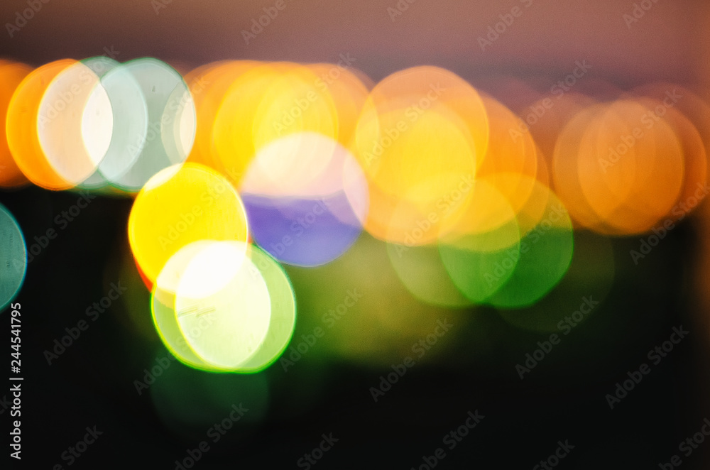Abstract scattered background with bokeh. Glowing yellow spots on a ...