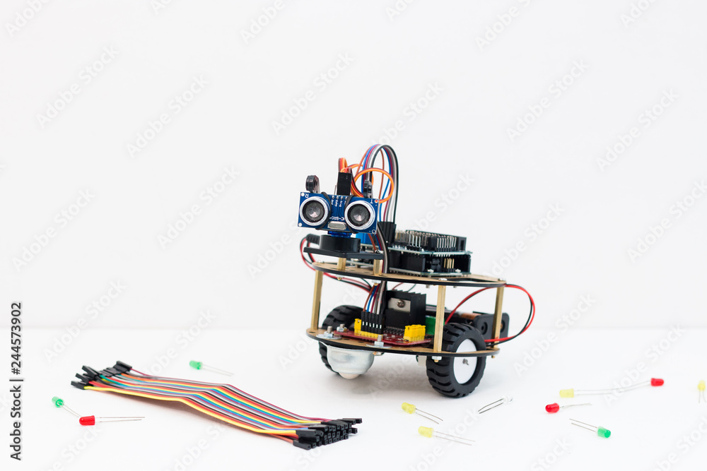 Hand made robot working on the arduino platform. White background. Free ...