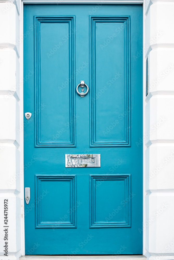 Beautiful blue door with letterbox in a white house facade in Notting ...