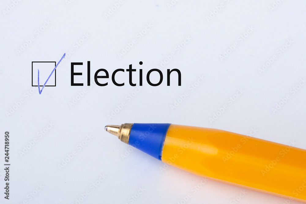 Election - checkbox with a tick on white paper with yellow pen ...