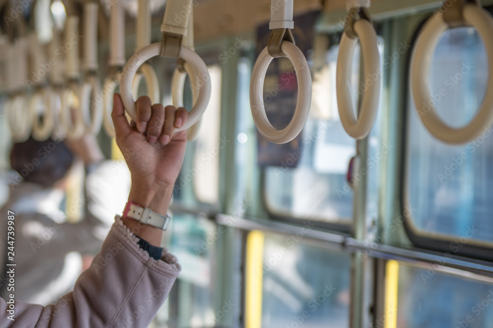 Safety travel trip, young passenger woman hand holding Handle on the ...