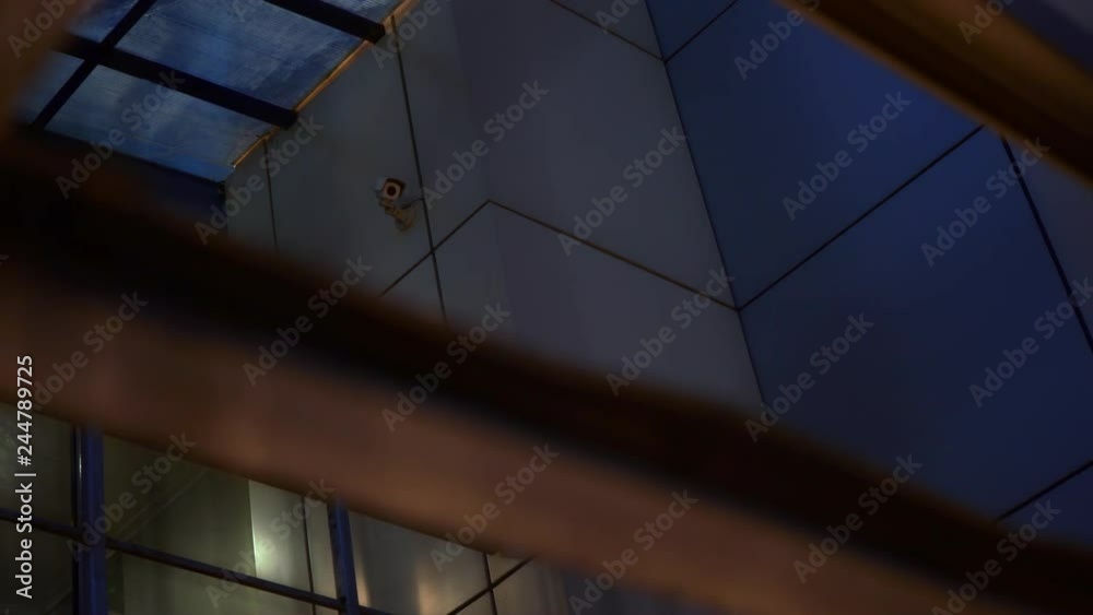 Surveillance camera in prison. Prison cell lattice. Watching people ...