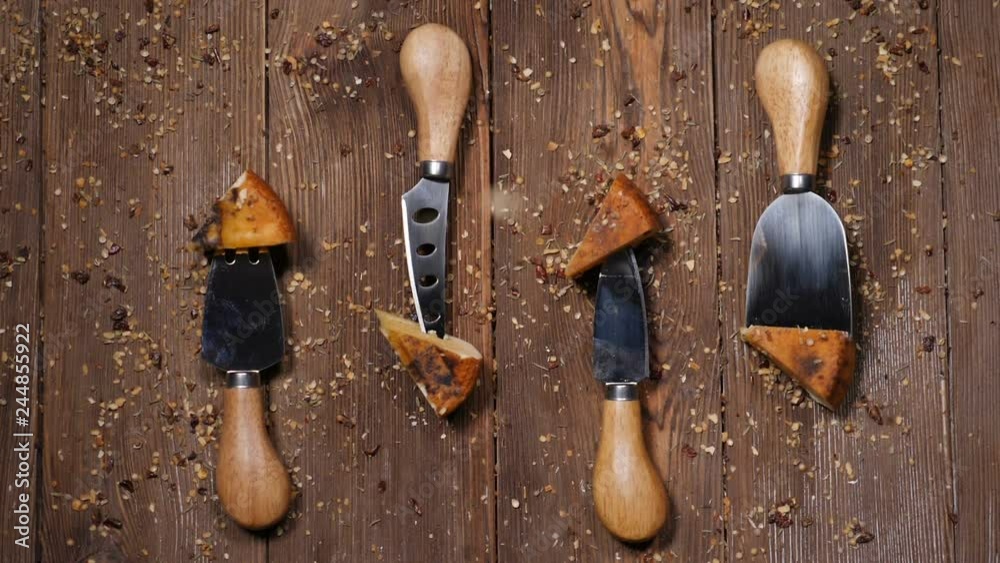 Think different concept. Cheese knives with pieces of gelicious hard ...