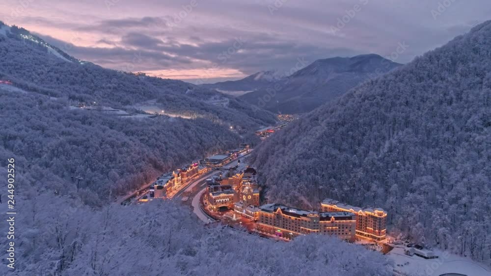 Aerial drone establishing shot of white winter valley Rosa Khutor ...