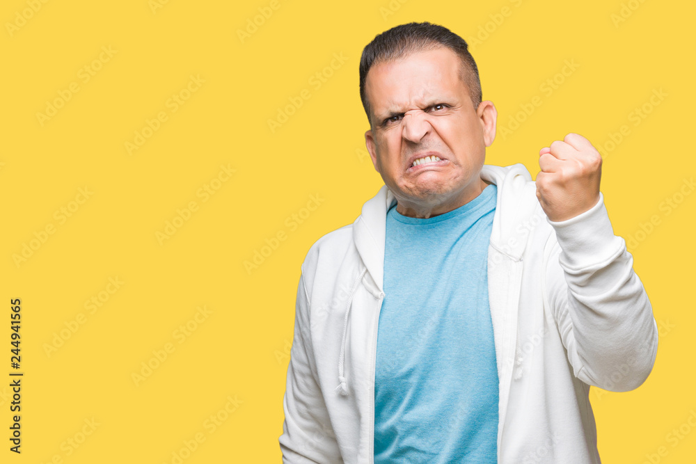 Middle age arab man wearing sweatshirt over isolated background angry ...