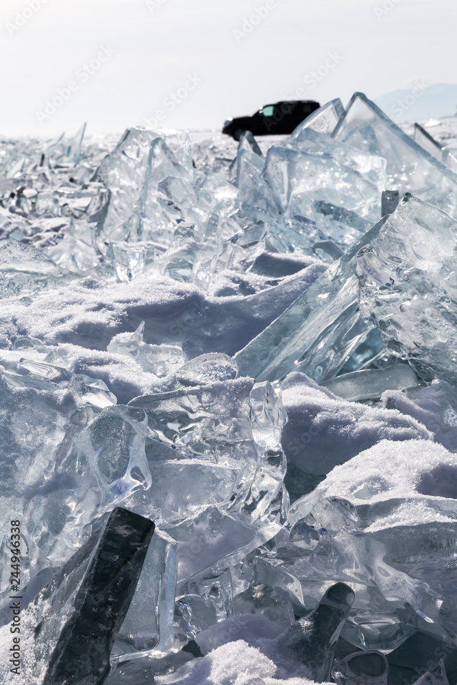 Typical for Baikal Lake hummocky field of transparent large ice blocks ...
