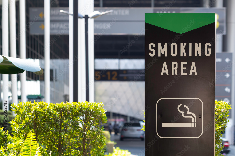 Smoking area sign outside the building. Stock Photo | Adobe Stock