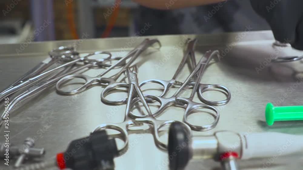 Close up hands and a table of surgical nurse during laparoscopic ...