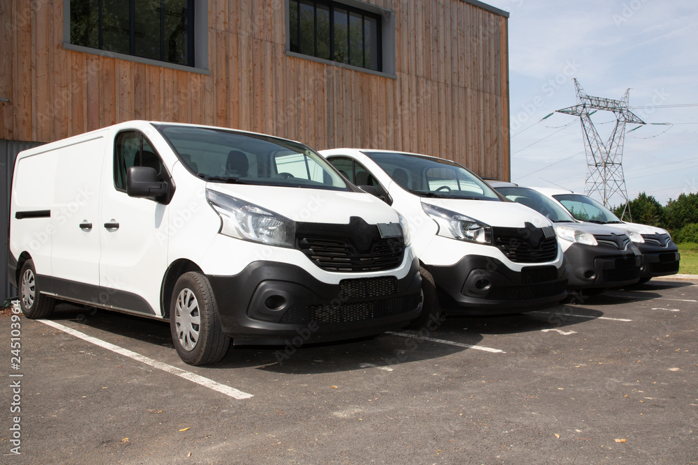 delivery van small trucks line up park outside Stock Photo | Adobe Stock