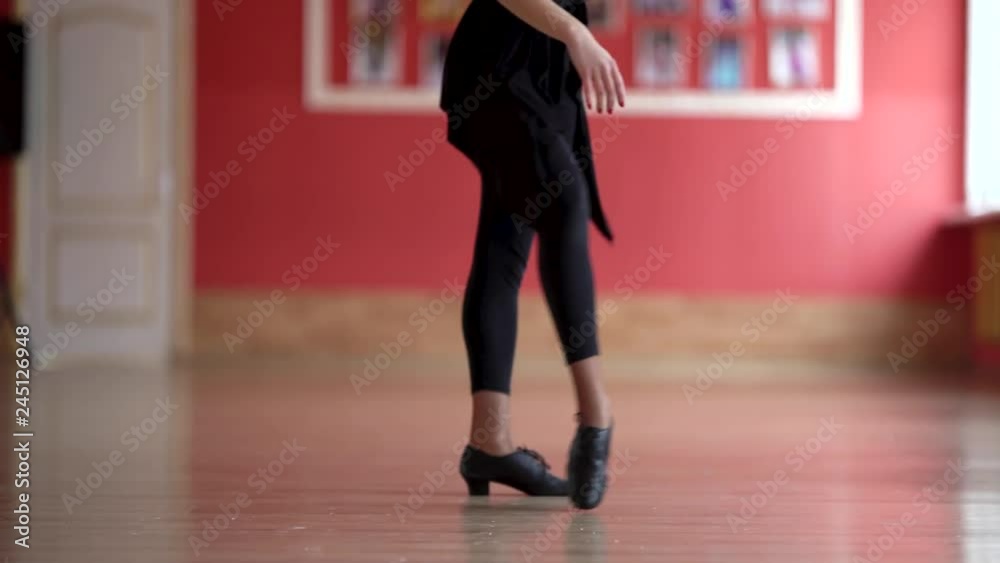 Close scene of woman's legs. girl is dancing hall also she is in ...