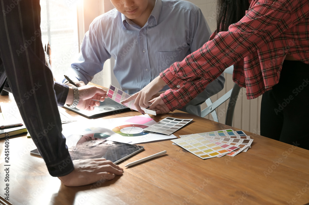 Team of graphic designer and colour swatches with pens on a desk. Stock ...