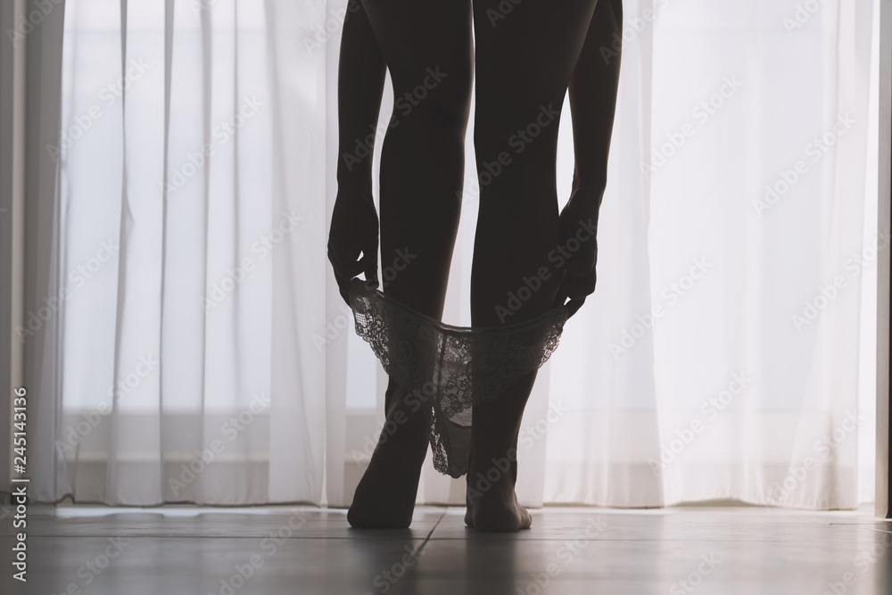 Bottom View Of Silhouette Of Beautiful Woman With Sexy Legs Taking Off