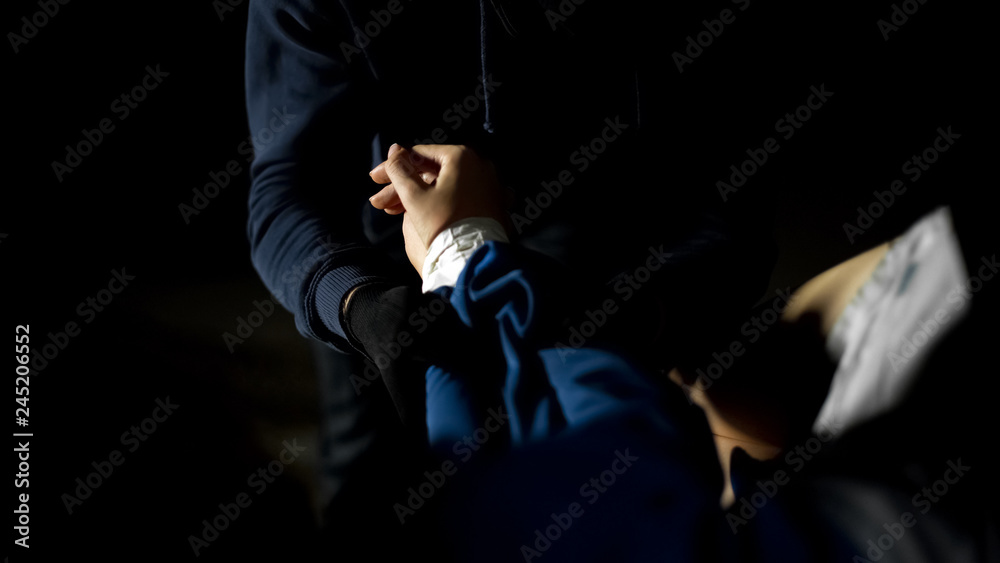 Male criminal opening car trunk and checking female victim pulse ...