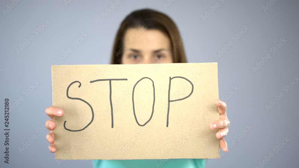 Stop sign in woman's hands, termination of infringement of womens ...