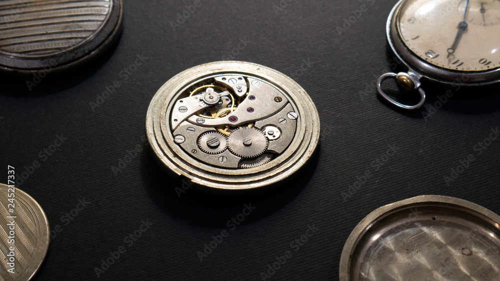 Mechanisms of watches and their parts on a black background Stock-Foto ...
