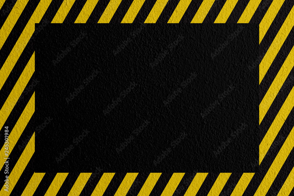 Safety sign yellow and black on mortar texture warning to be careful of ...