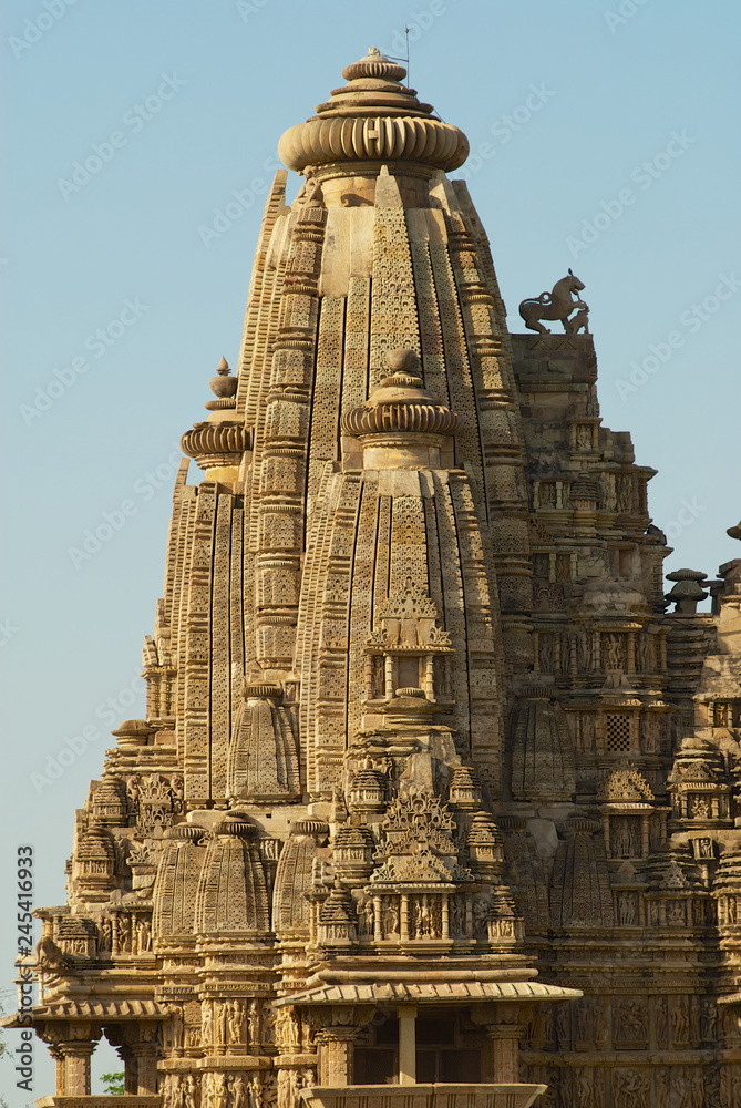 Facade of the Vishvanatha Temple with erotic sculptures at the Western temples of Khajuraho in ...