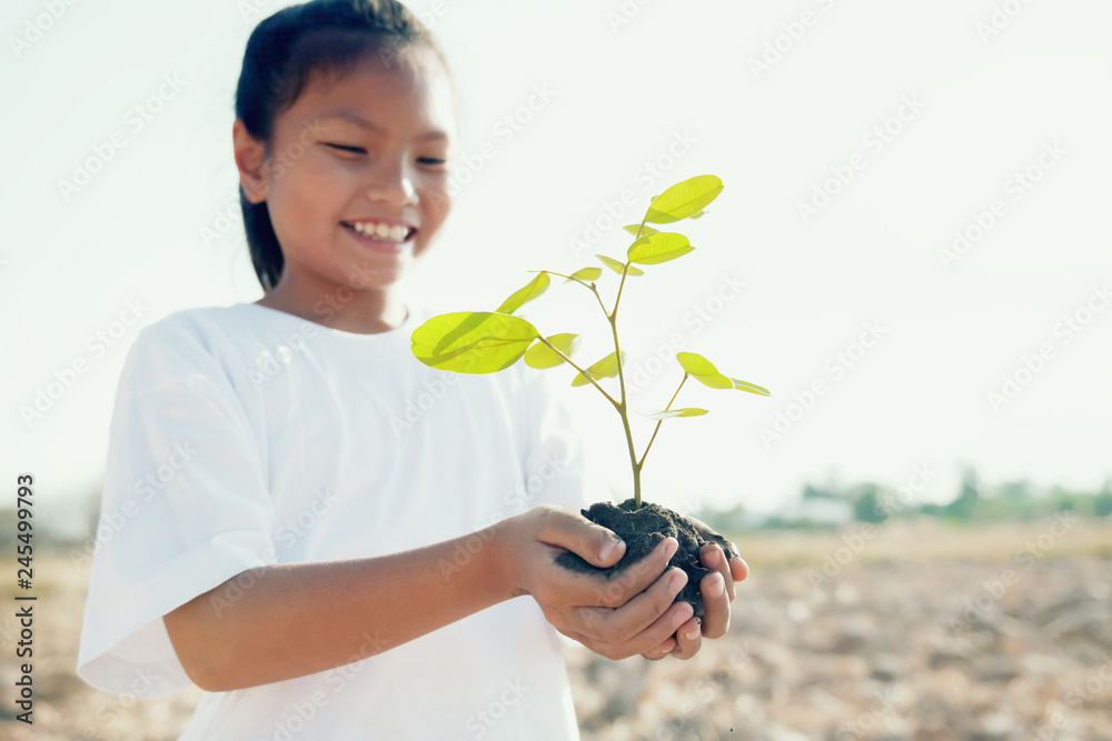 smile children holding young tree for planting. concept save world ...