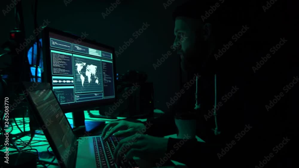 Wanted hackers coding virus ransomware using laptops and computers in ...