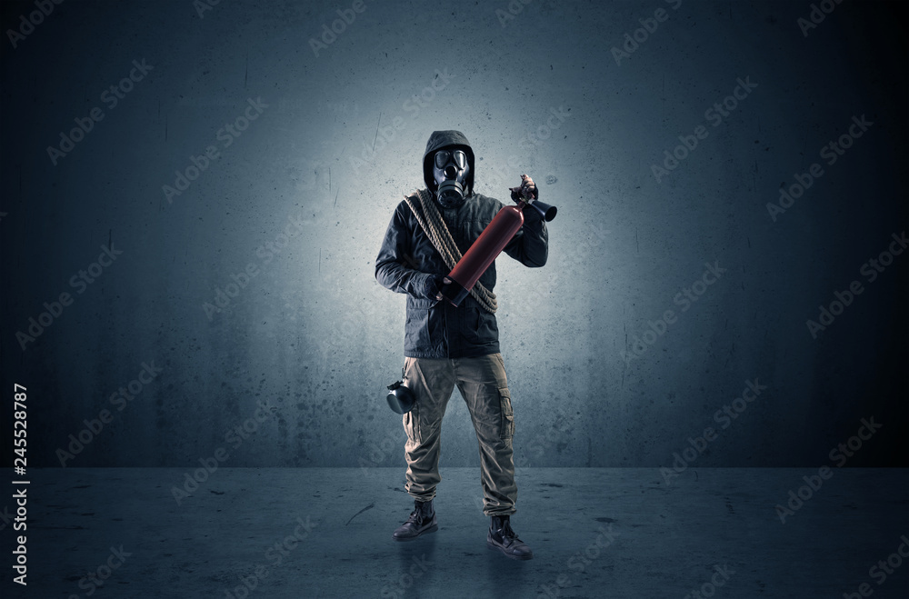 Bad agent in a dark room with arms on his hand and gas mask Stock Photo ...