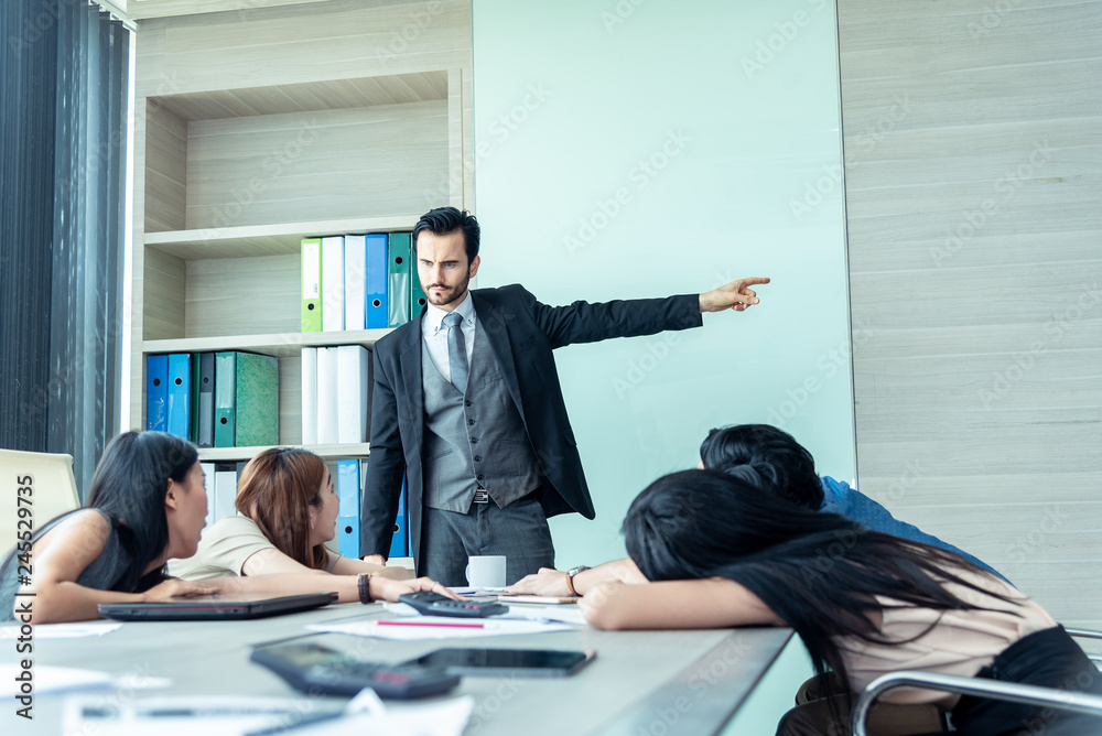 Angry furious caucasian male boss complaining, yelling to employee team ...