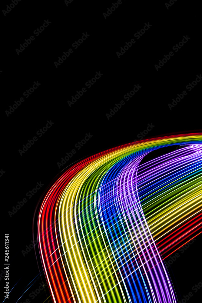 Abstract lines made with light painting with the colors of the rainbow ...