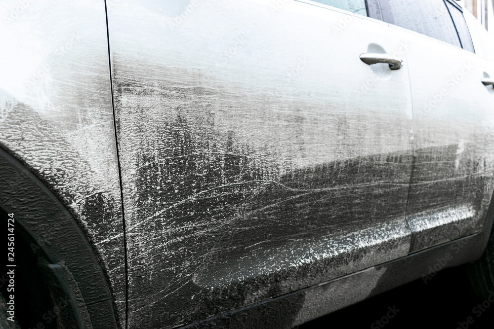 Side view of a very dirty car. Fragment of a dirty SUV. Dirty ...