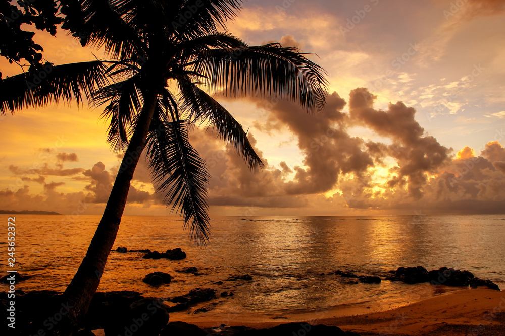 Colorful sunrise on the beach in Lavena village in Taveuni Island, Fiji ...