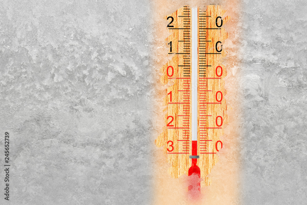 Thermometer on a frosty winter window. Outdoor temperature minus 25 ...