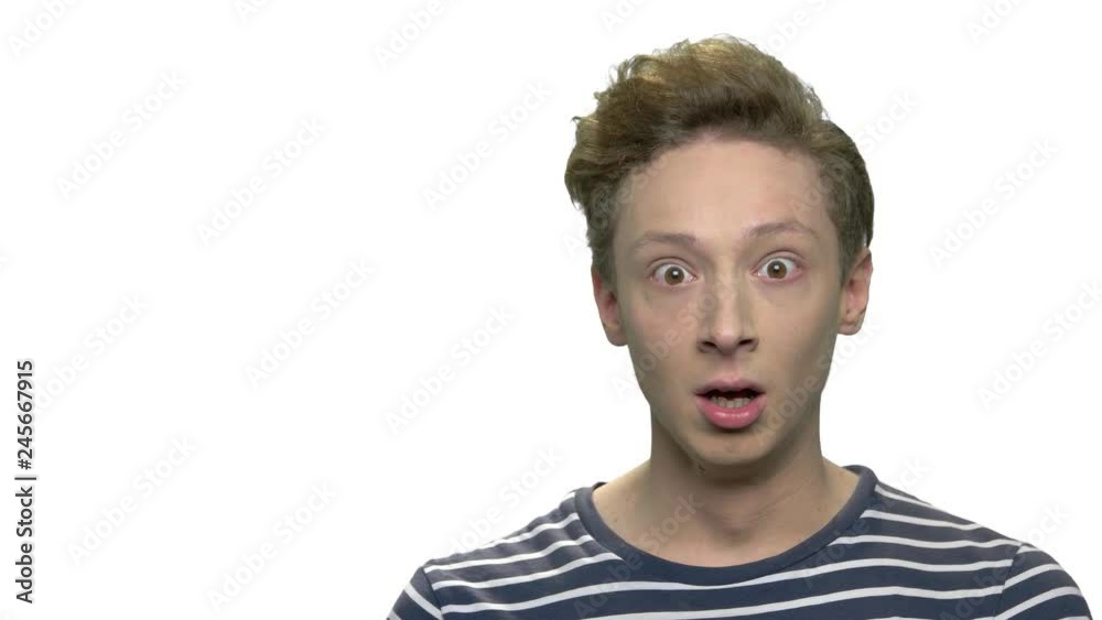 Shocked teenage boy isolated on white. Portrait of scared caucasian ...