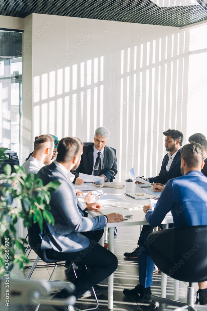 onstruction company management board members headed by grey-haired ...
