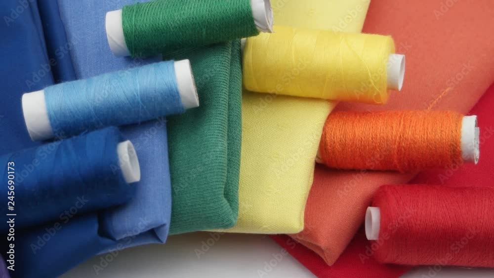Composition of the set of colorful cotton fabric and spools of colorful ...